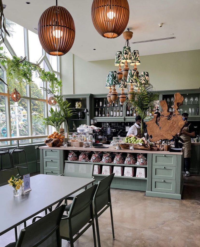 THIS LUSH GARDEN-INSPIRED CAFÉ IS HIDDEN IN A FURNITURE STORE IN ...