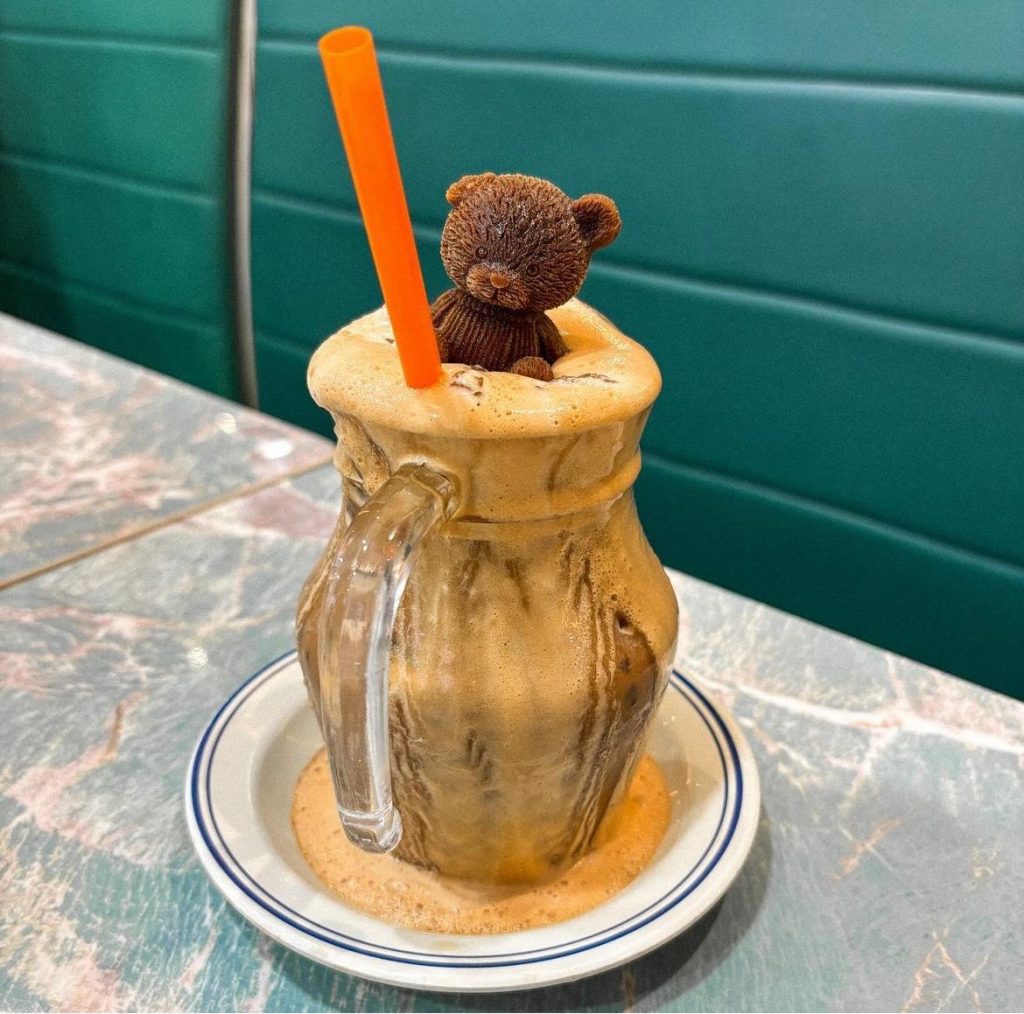 THIS CAFÉ HAS MILO DINOSAUR OVERLOADED WITH MILO POWDER & TOPPED WITH ...